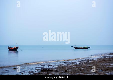 Indian native rustic wooden fishing boats in bay of Bengal to capture ...