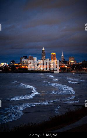 Cleveland ohio skyline at night with a ship on the cuyahoga river Stock ...