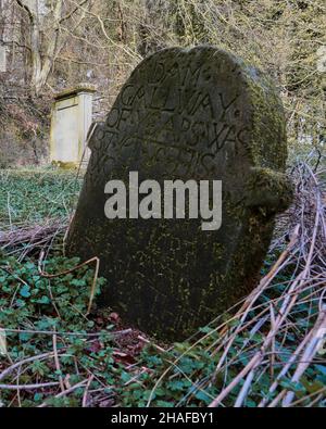 old mossy grave with writing Stock Photo - Alamy
