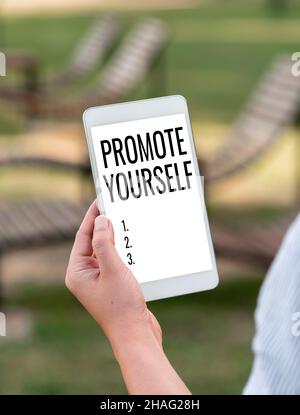 Hand writing sign Promote Yourself, Business idea the act or practice ...