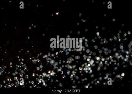 Abstract bokeh texture on black background Stock Photo - Alamy