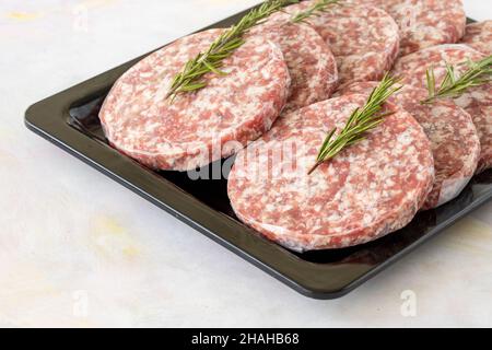packaged raw beef burger meat on white wooden background. Meat ...
