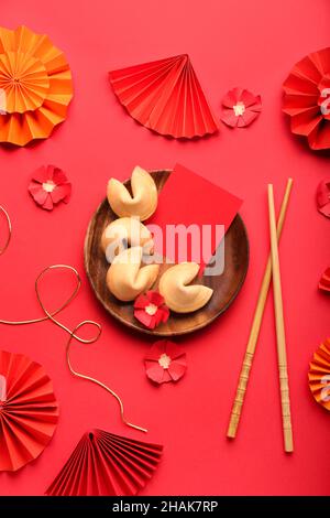 Plate with fortune cookies and Chinese symbols on blue background ...