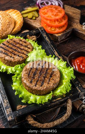 Roasted meat free patties, plant based meat burger cutlets in wooden ...