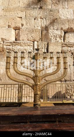 The huge traditional and state-owned menorah in the Western Wall plaza ...