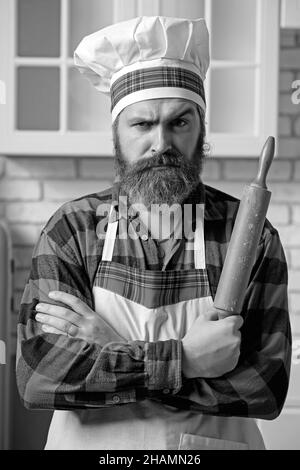 hipster cook preparing food in home kitchen, healthy food Stock Photo ...