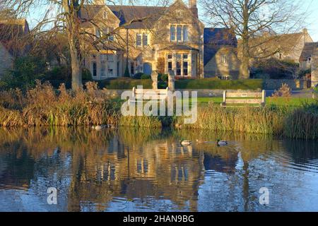 Winter view of Biddestone vollage in Wiltshire England. Low winter sun ...