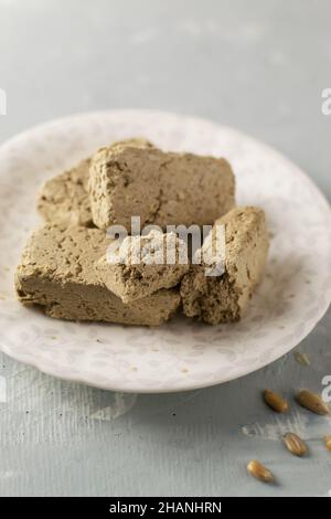 Concept of tasty food with halva on white textured background Stock Photo - Alamy