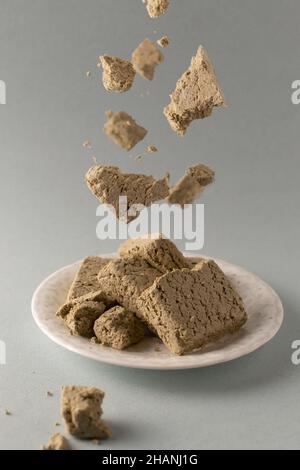 Concept of tasty food with halva on wooden background Stock Photo - Alamy