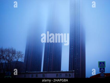 Multiple skyscrapers in fog scary architecture Stock Photo - Alamy