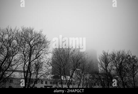Multiple skyscrapers in fog scary architecture Stock Photo - Alamy