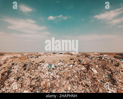 Proof of human negligence. On picture big pile of trash ruining nature ...