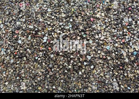 The texture of the landmark Berlin Wall is covered with chewing gum ...