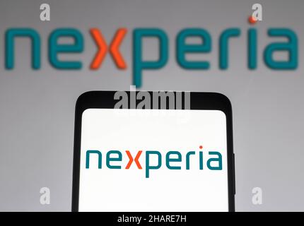In this photo illustration, a Nexperia logo is displayed on a ...