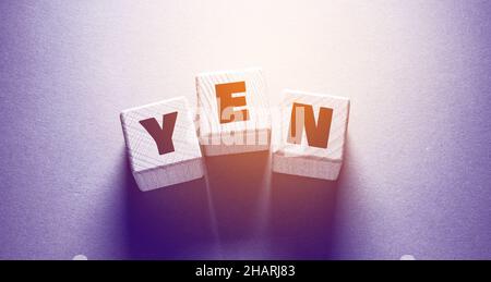 Yen symbol with word YEN on cubes Stock Photo - Alamy