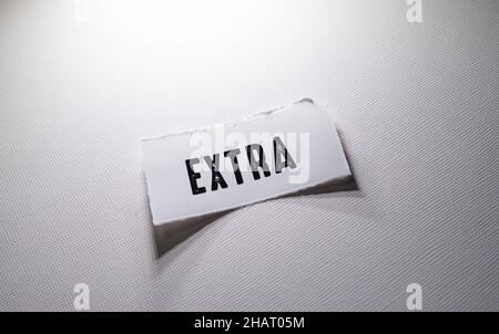 Close up of Extra Word , Business Concept idea Stock Photo - Alamy