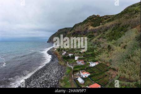 View of the cliff and settlement of Rocha da Relva, Sao Miguel Island ...