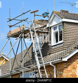 Builders scaffolding tower around dormer rooms for safe ladder access ...