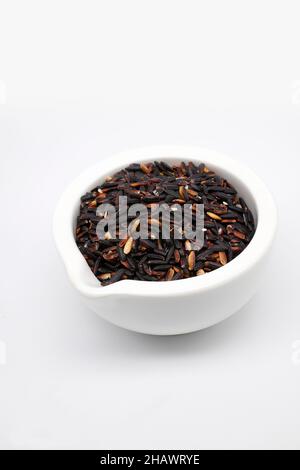 black sticky rice porridge in a bowl. bubur ketan hitam Stock Photo - Alamy