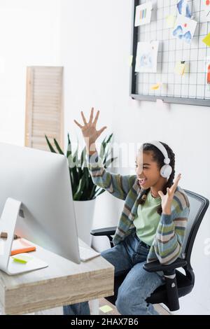 Excited teenager girl. Schoolgirl child student with backpack and warn ...