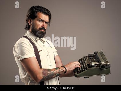 mature typist use vintage typewriter. masculinity and charisma. formal ...
