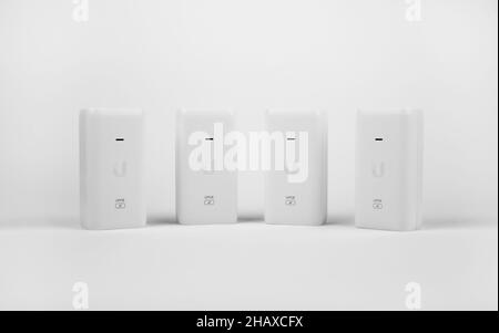 White PoE injector for electronic equipment on a white background Stock ...