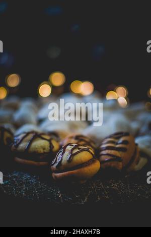 Moody picture of traditional Christmas bakeries on a place with bokeh effect and cozy atmosphere ...