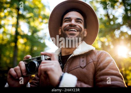 Photo of cheerful stylish man wear trendy clothes arm direct empty ...