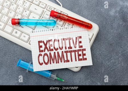 Sign displaying Executive Committee. Concept meaning Group of Directors ...