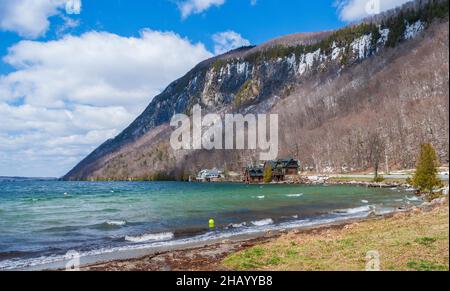 Lake Willoughby - a deep blue lake flanked by steep mountains in ...