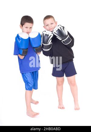 Two kids sparring. Kids Kickboxing fight. Isolated on a white ...