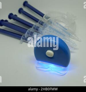 Teeth whitening equipment and syringes on a white surface Stock Photo ...