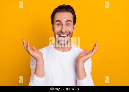 Photo of cool impressed young guy dressed green t-shirt arms dark ...
