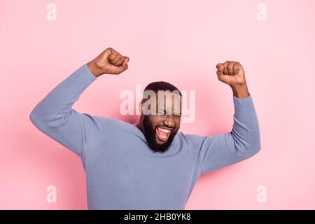 Photo of astonished cheerful man wear bright aquamarine trendy clothes ...