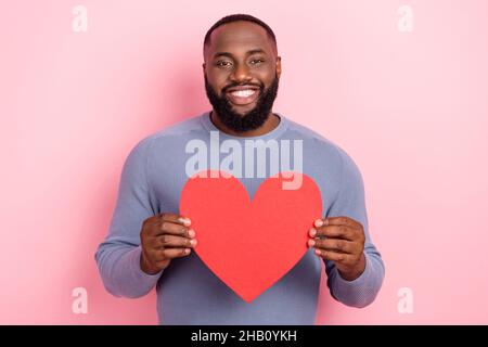 Photo of romantic guy toothy smile show love heart symbol wear purple t ...