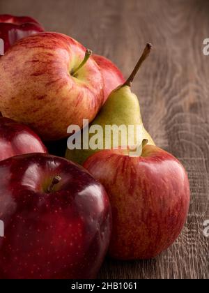 Photo shows several apples and one pear. Photo was taken in studio ...