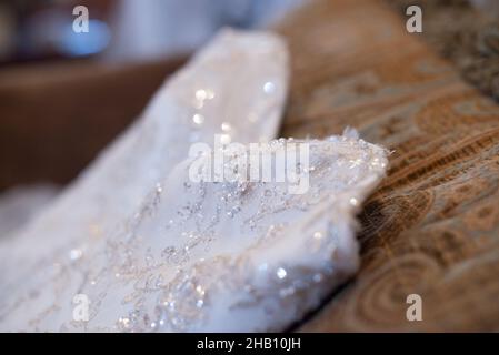 White wedding dress layed out close up Stock Photo - Alamy
