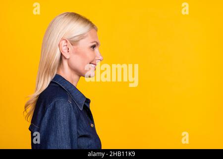 Photo of shiny sweet girl dressed striped t-shirt reading modern gadget ...
