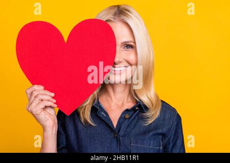Photo of charming sweet lady pensioner wear striped shirt pointing ...