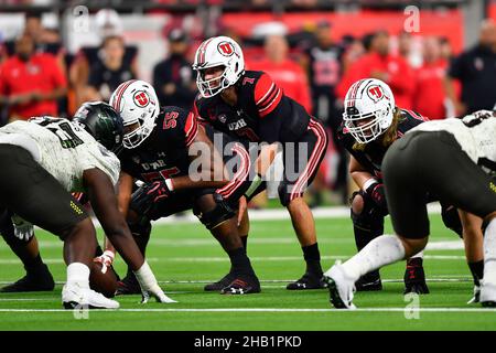Utah quarterback Cameron Rising, center, warms up before the Pac-12 ...