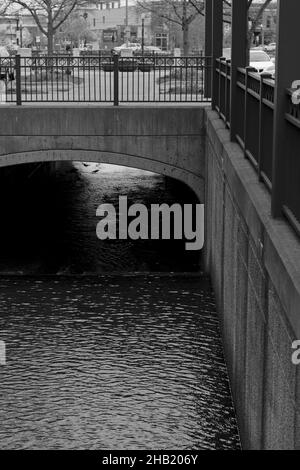 A grayscale shot of a bridge over the river Stock Photo - Alamy
