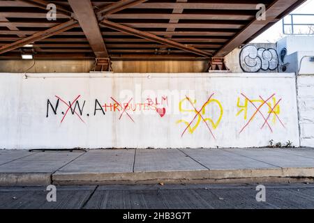 White wall with various graffiti where the original graffiti of NWA and ...