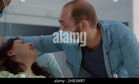 Screaming woman giving birth to child at maternity in hospital ward ...