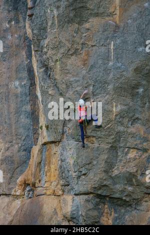 Young woman practices rock climbing in Chulilla. Valencia. December ...