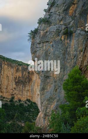 Young woman practices rock climbing in Chulilla. Valencia. December ...