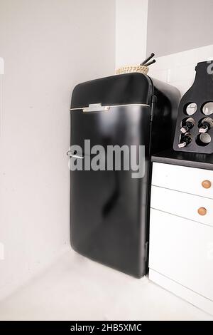 Interior of contemporary kitchen with stylish black cupboards and ...