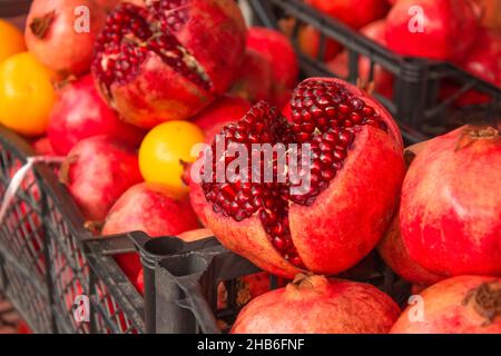 Close up to pomegranate with peel off and seeds in a glass bowl Stock ...