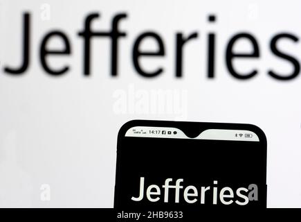 In this photo illustration the Jefferies Group logo seen displayed on a ...