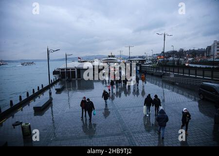 Istanbul, Turkey. 17th Dec, 2021. A man seen fishing during the rainy ...