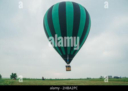 Inflating, unpack and flying up hot air balloon watermelon. Burner ...